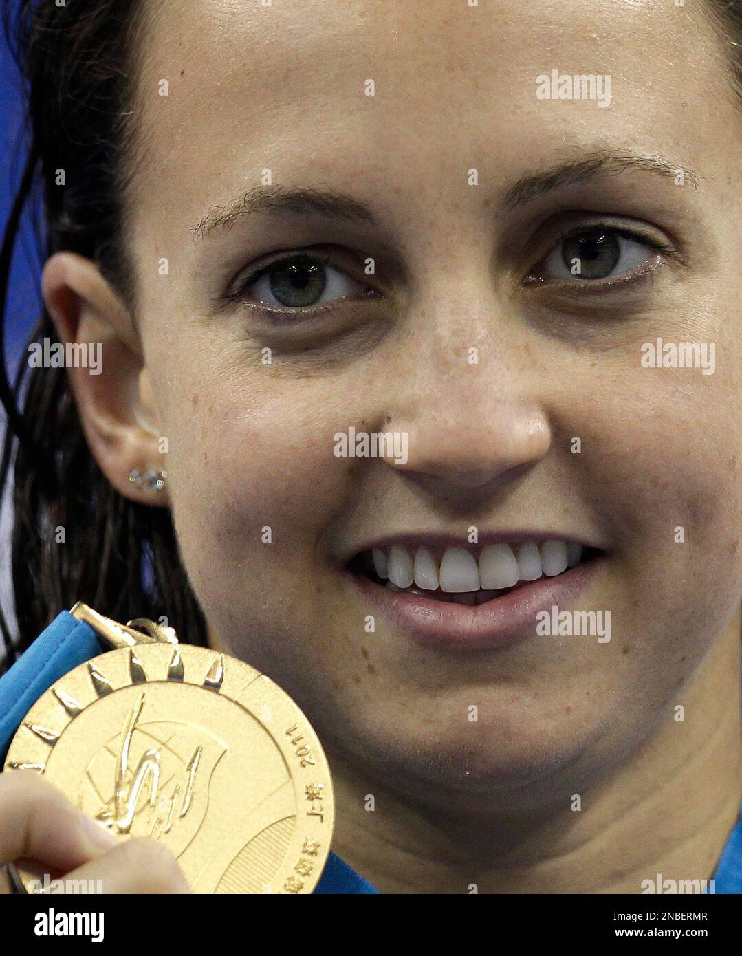 U.S. Rebecca Soni shows the gold medal she won in the women's 200m Breaststroke event at the ...