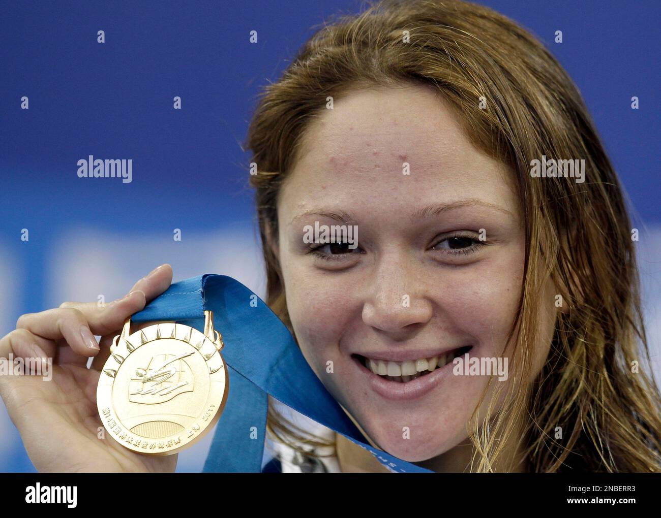 Belarus' Aliaksandra Herasimenia shows the gold medal she won in the ...