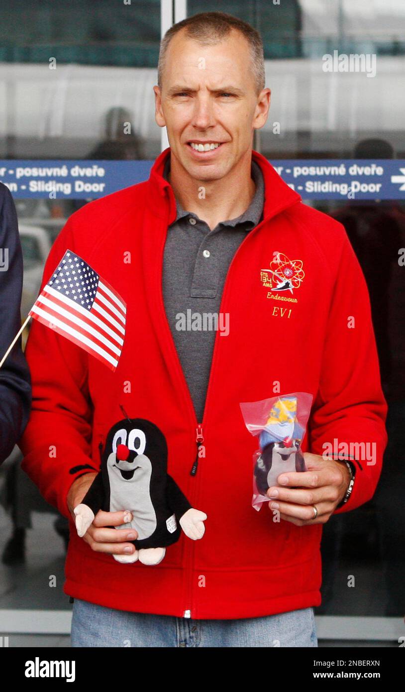 U.S. astronaut Andrew Feustel displays stuffed Little Mole which was ...