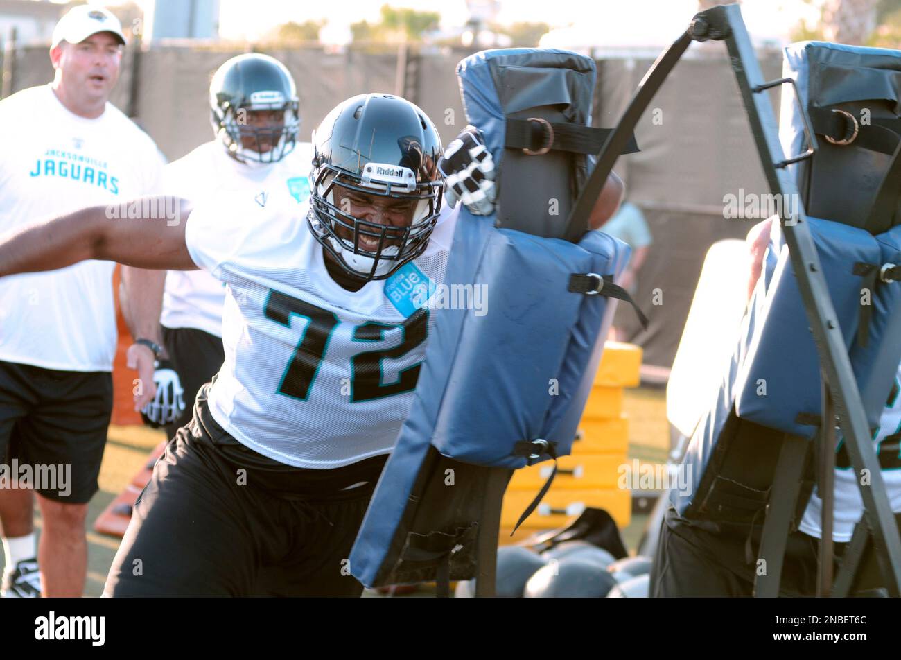 Jacksonville Jaguars offensive lineman Kevin Haslam (72) grimaces as he ...