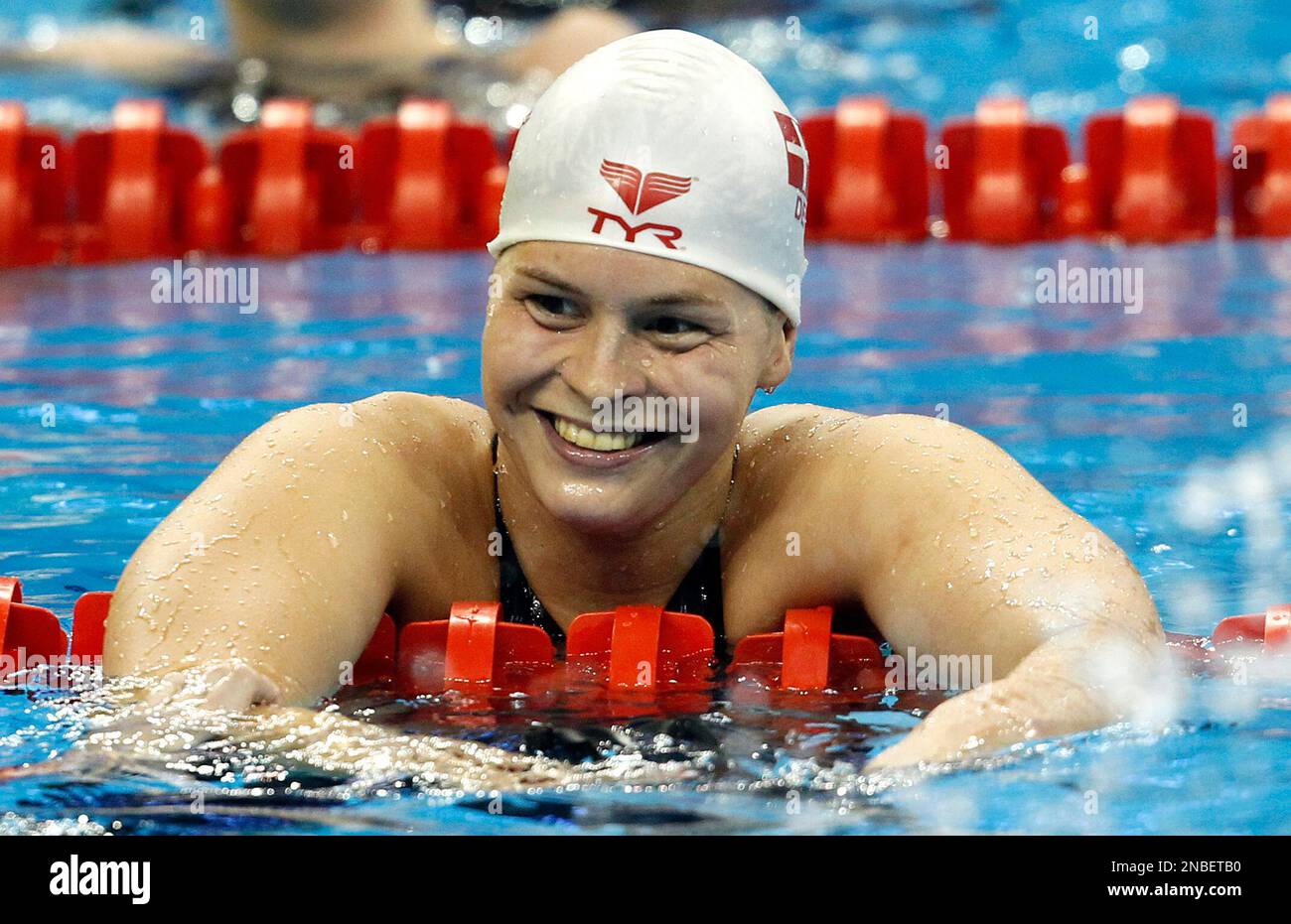 Denmark's Lotte Friis smiles after competing in a women's 800m heat, at ...