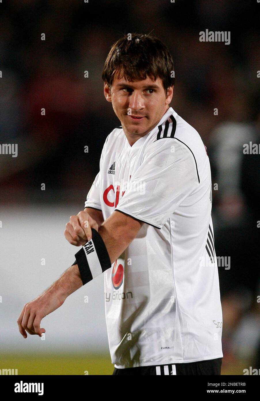 Barcelona FC soccer star Lionel Messi, from Argentina, adjusts his ...