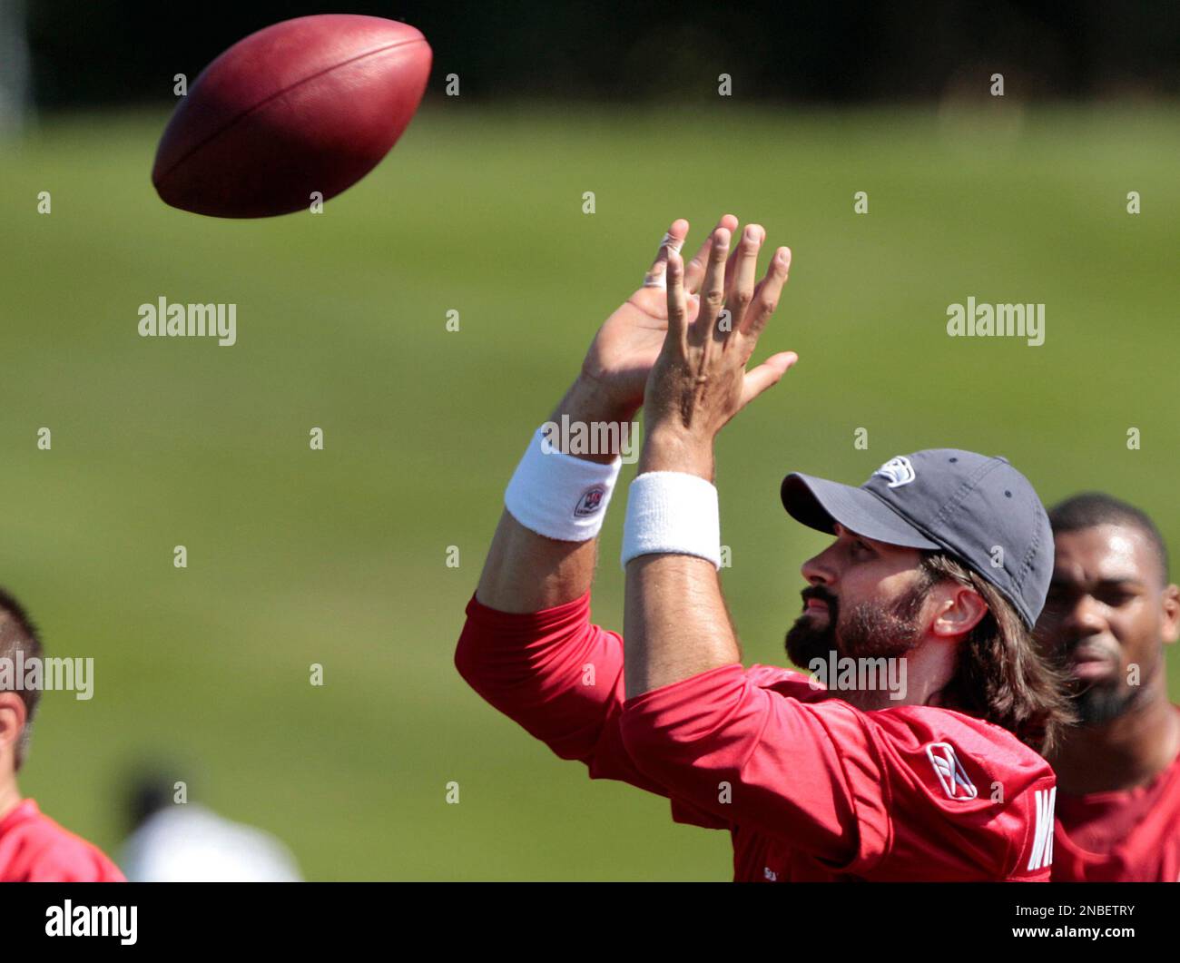 Seattle Seahawks quarterback Charlie Whitehurst reaches for a ball at a ...