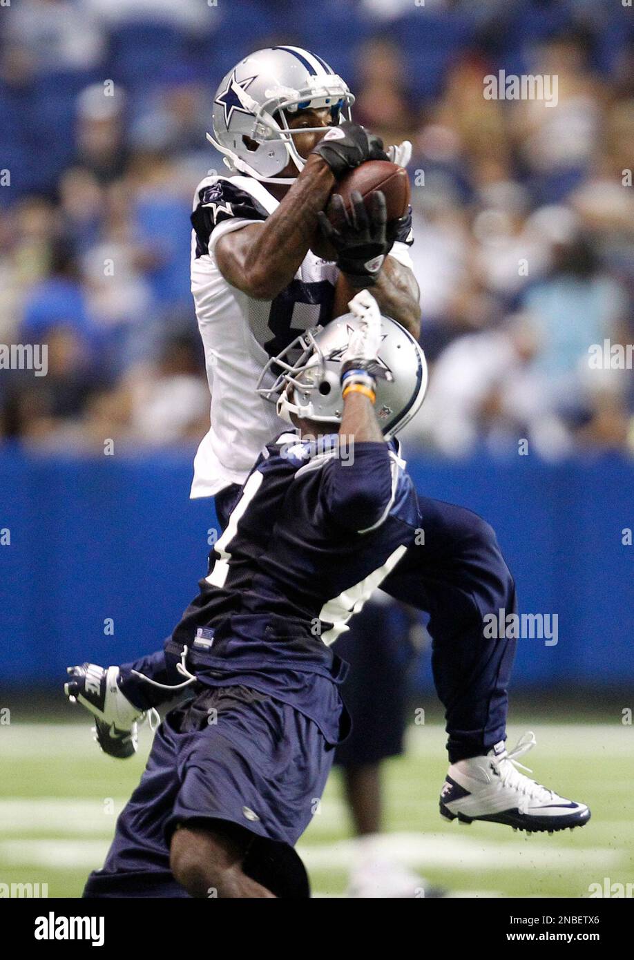 Dallas Cowboys' Kevin Ogletree catches a pass over defender Danny ...