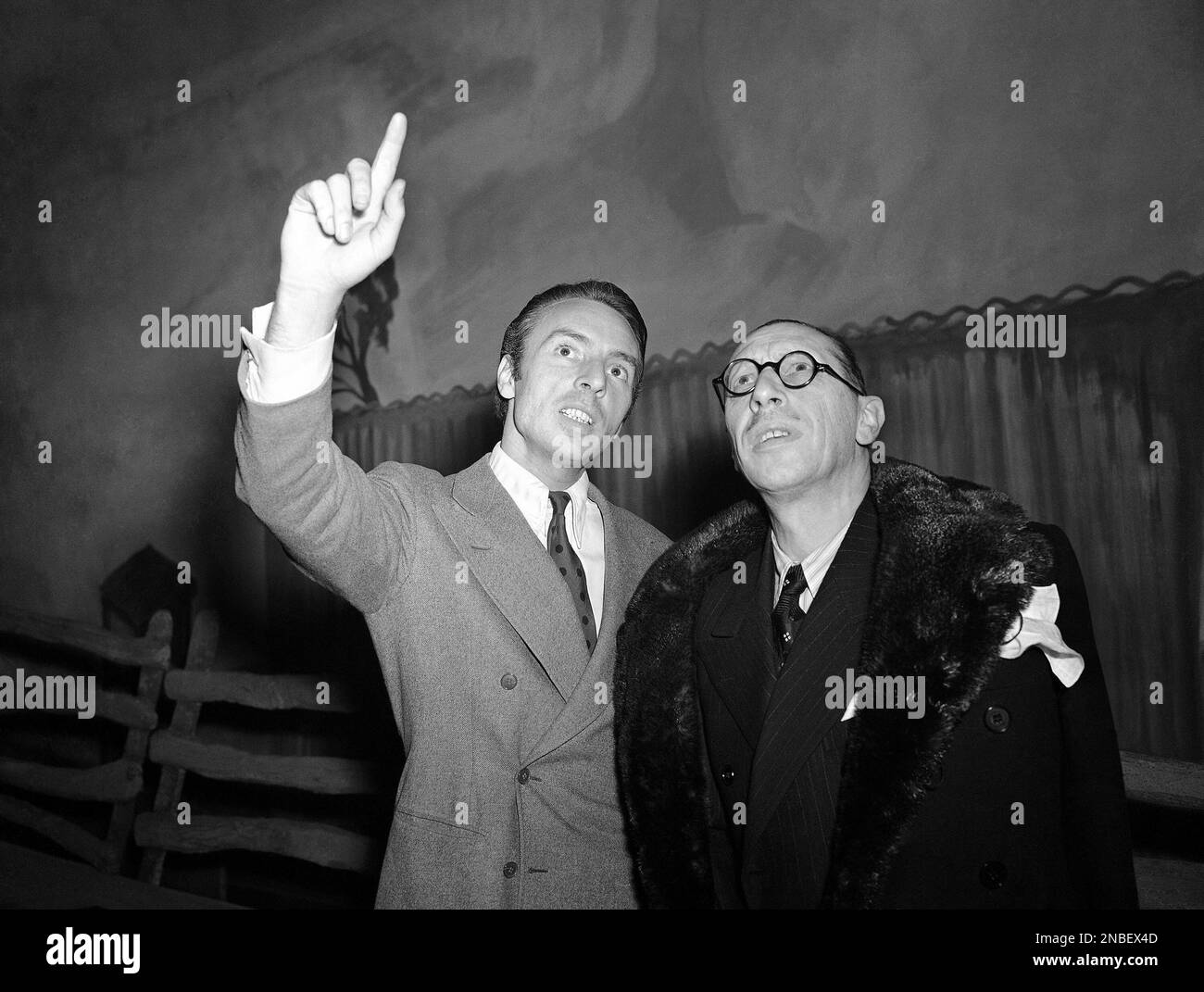 Igor Stravinsky, right, Russian composer, gets a look at another part ...