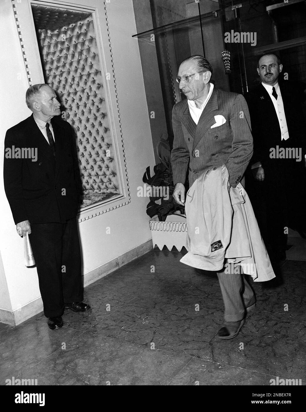 Igor Stravinsky entering the Hotel where he will stay in Venice, Italy ...