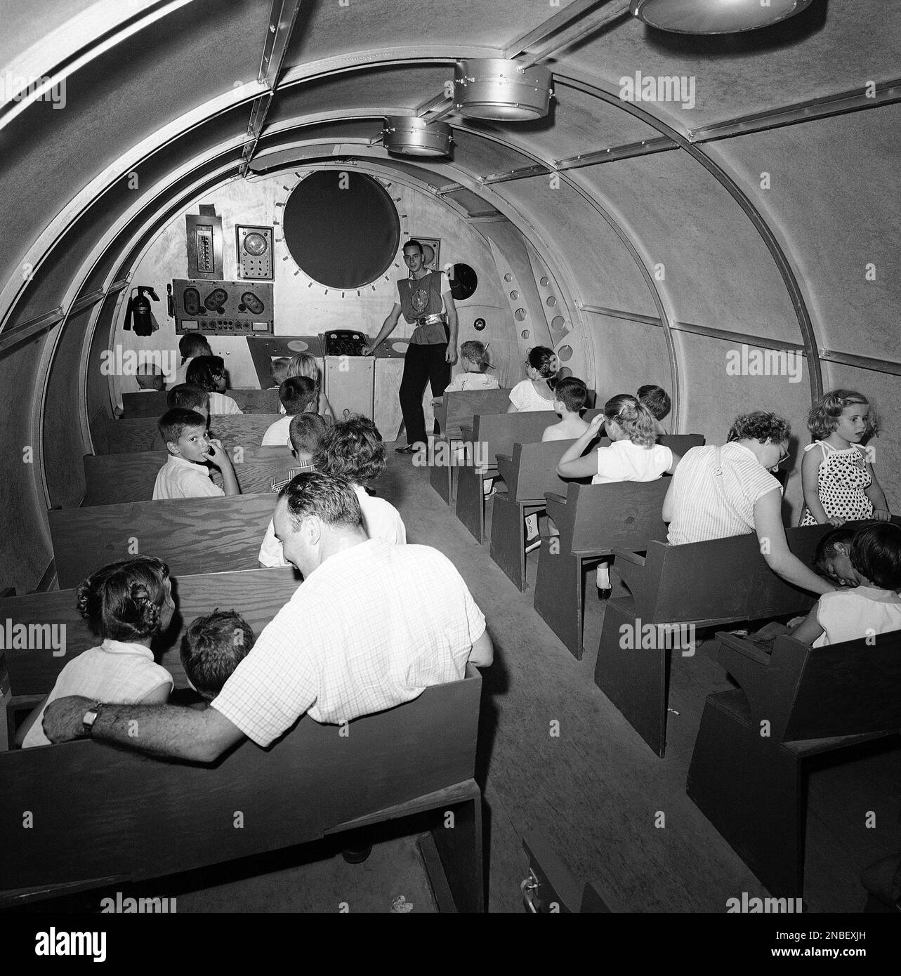 The youngsters are seated inside the 76-foot rocket at Spaceland in ...