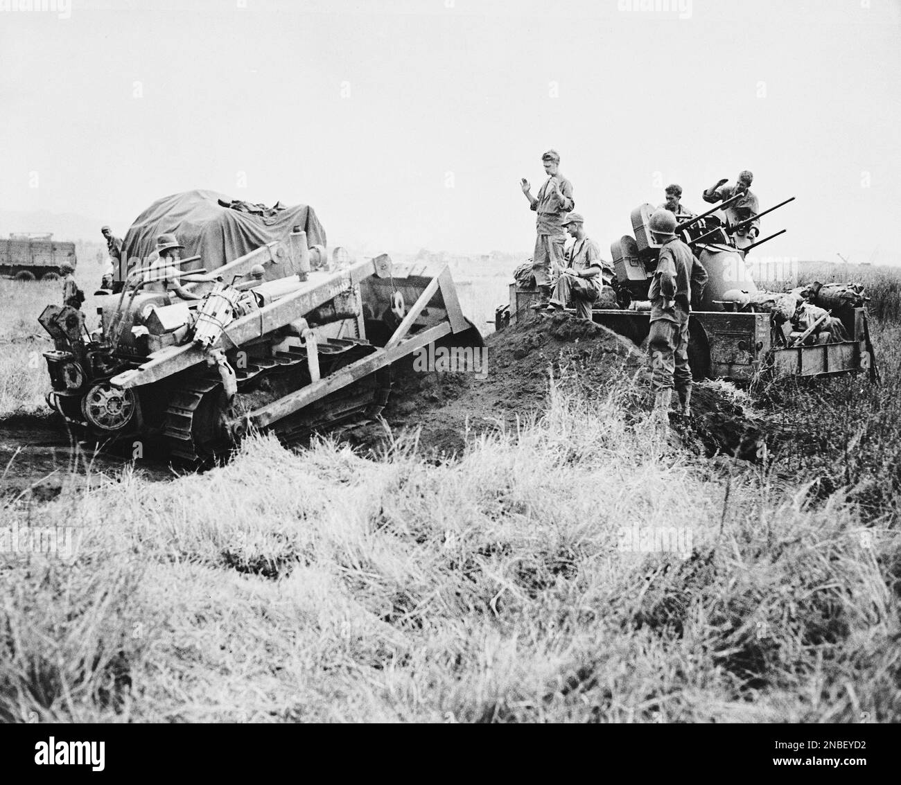 An Aussie manned Royal Australian Air Forces bulldozer lends a hand in ...