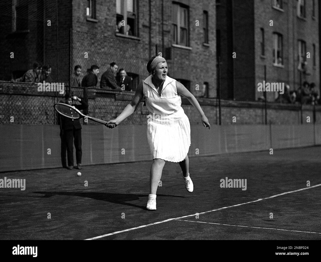 English tennis player Betty Nuthall during a match against Miss Harvey ...