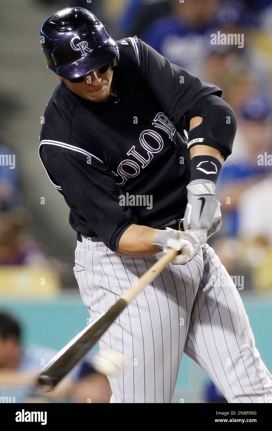 Colorado Rockies' Troy Tulowitzki hits an RBI single to score Eric ...