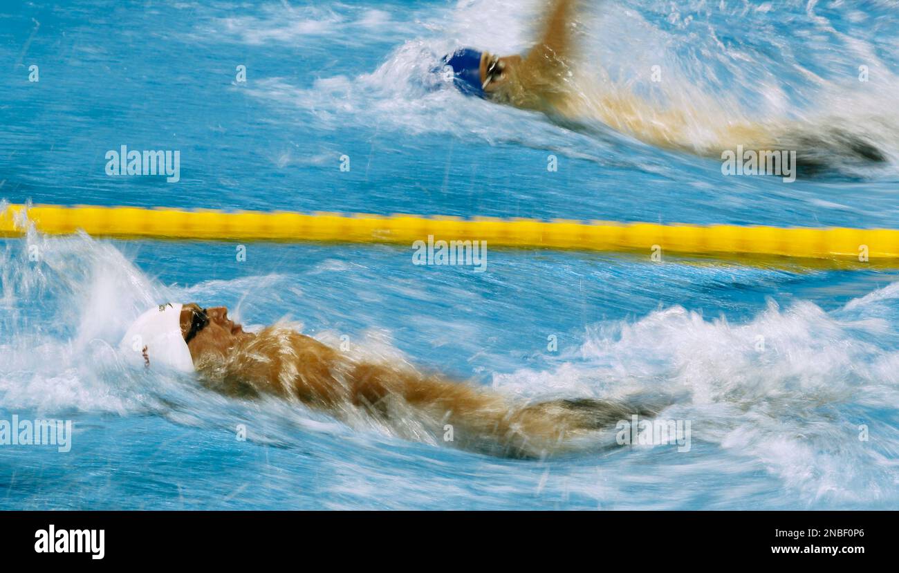 Ryan Lochte of the U.S., foreground, and Britain's Christopher Walker ...