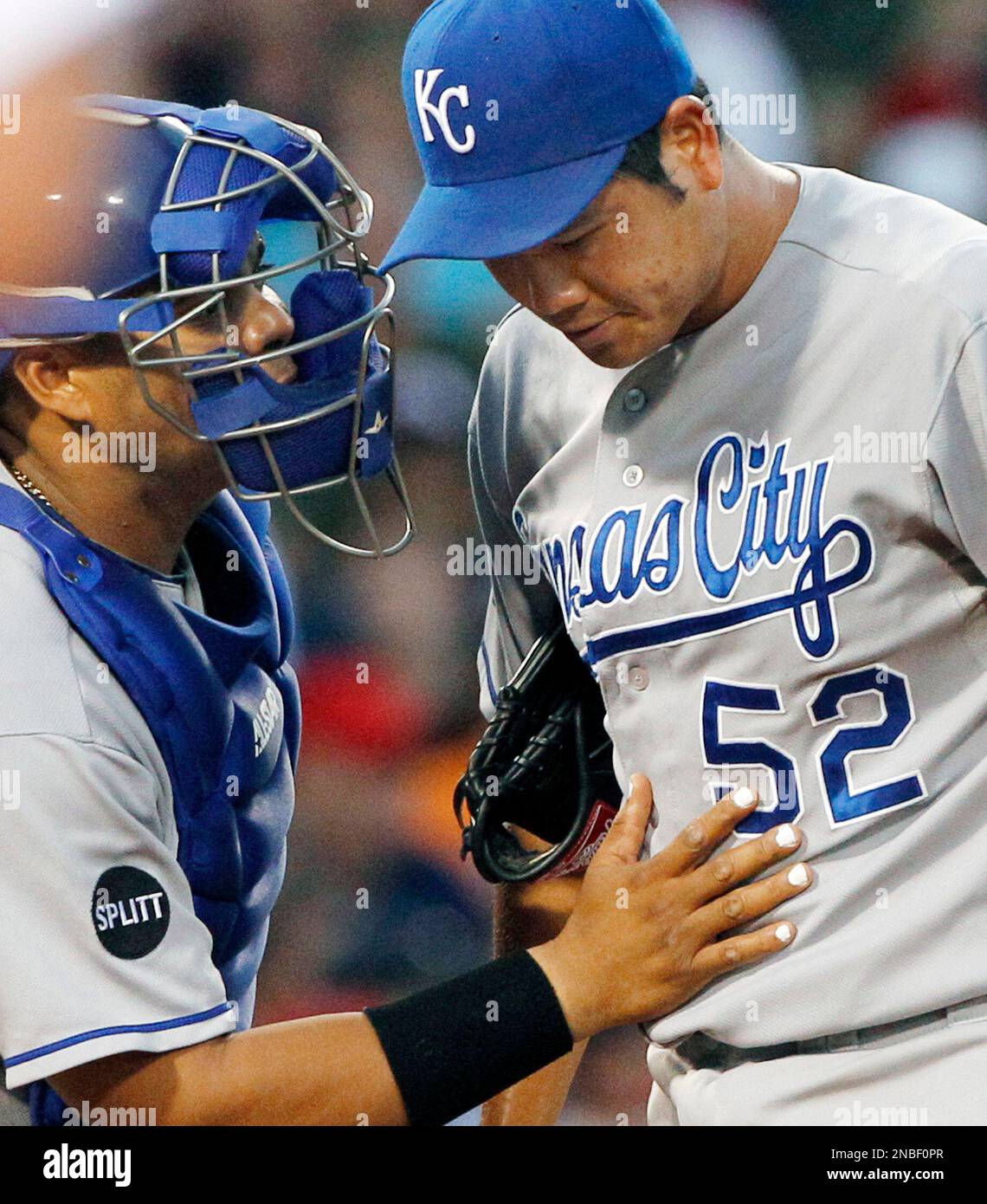 Kansas City Royals catcher Brayan Pena speaks to starting pitcher Bruce ...