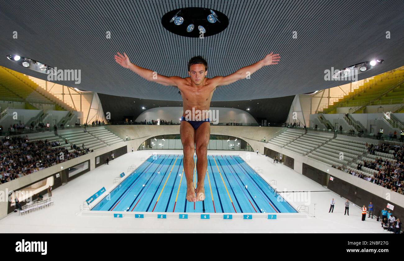 British Olympic diver Tom Daley performs a dive into the new aquatic ...