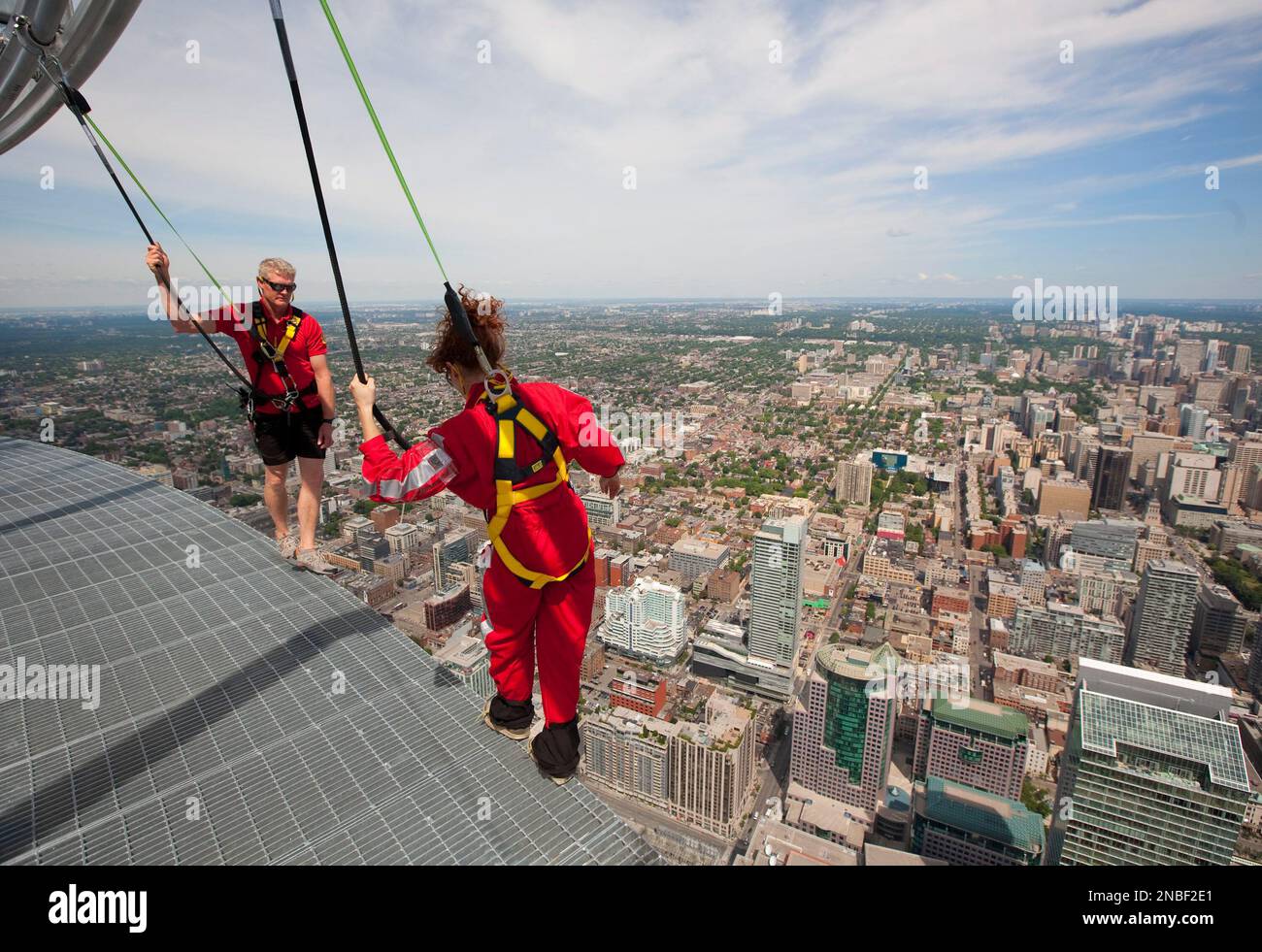 EdgeWalk guide Iain Murdoch, left, helps Canadian Press reporter ...