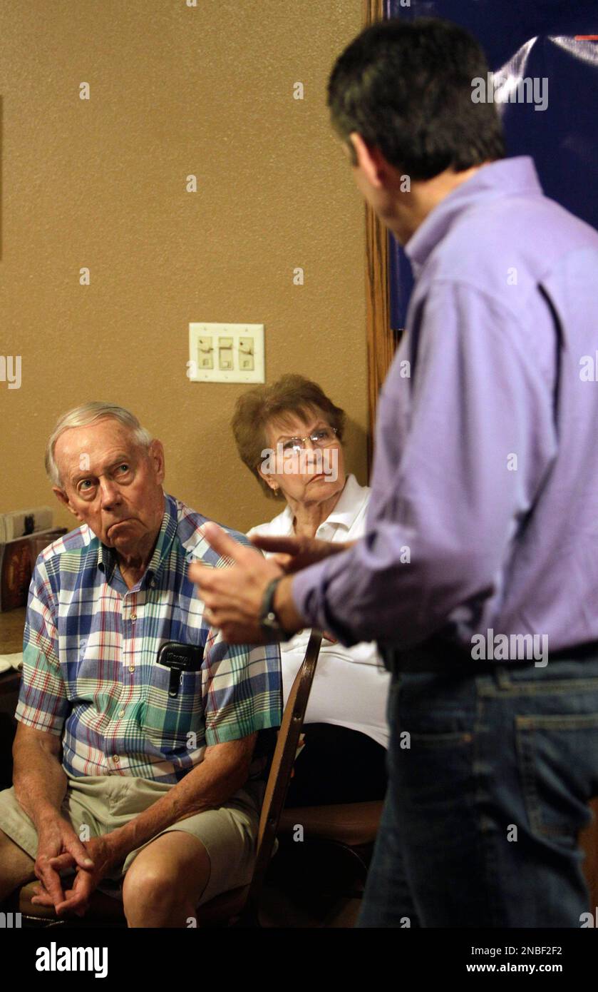 Ken Jensen and his wife Elinor, of Ames, Iowa, listen to Republican ...