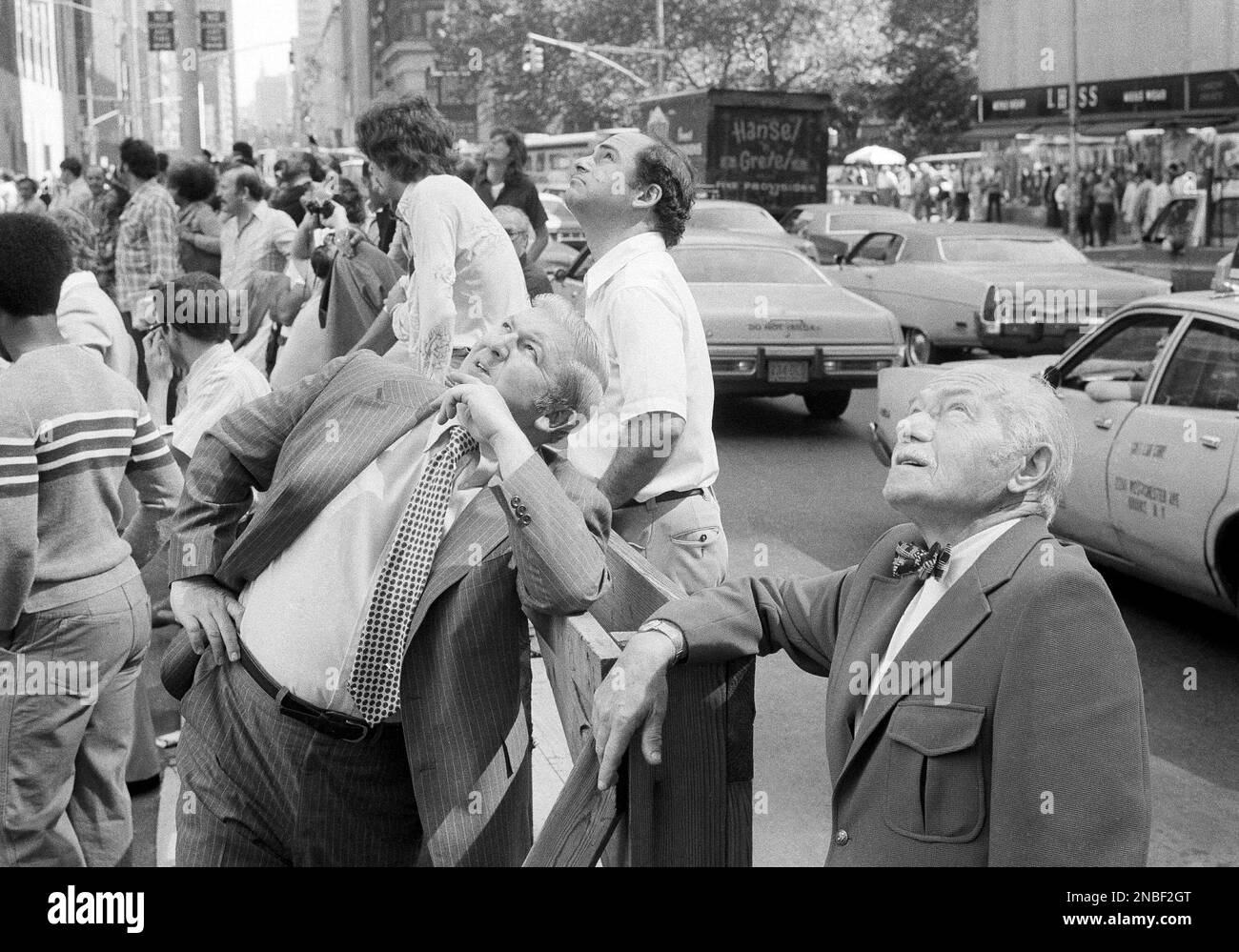Most of the crowd near the World Trade Center looks straight up to ...