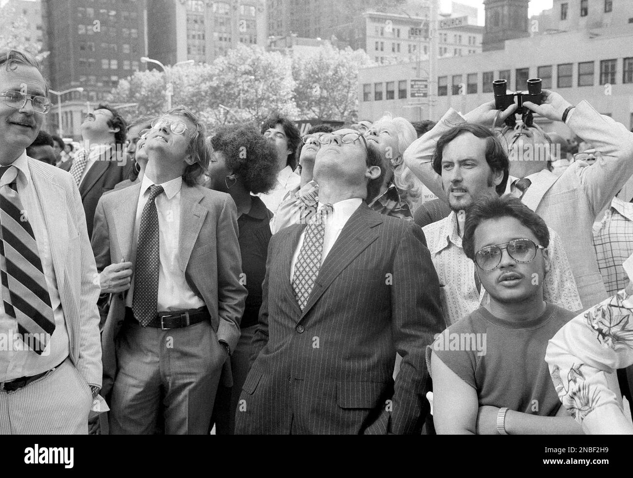 Most of the crowd near the World Trade Center looks straight up to ...