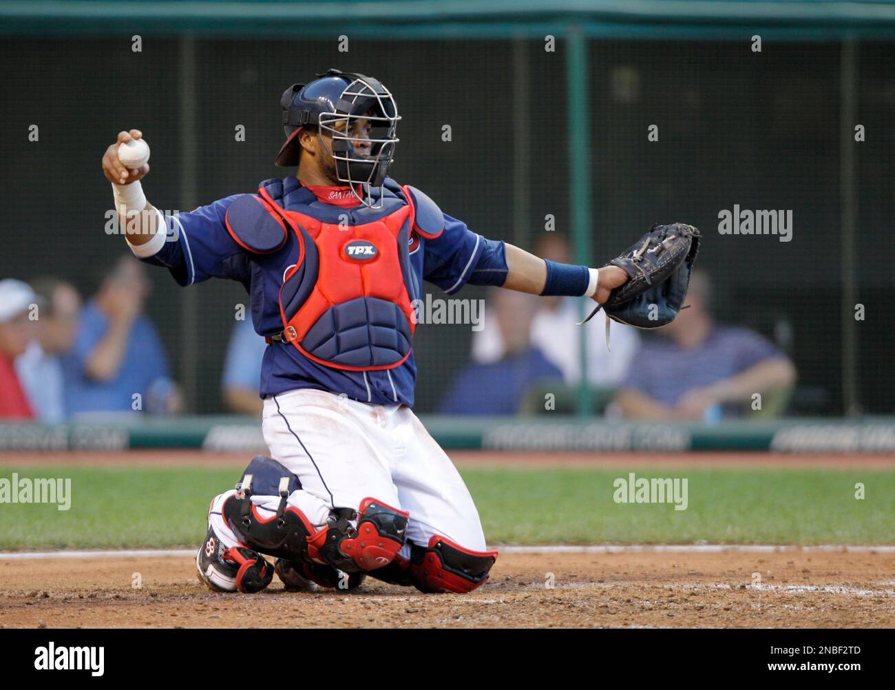 Cleveland Indians catcher Carlos Santana warms up his pitcher during a ...