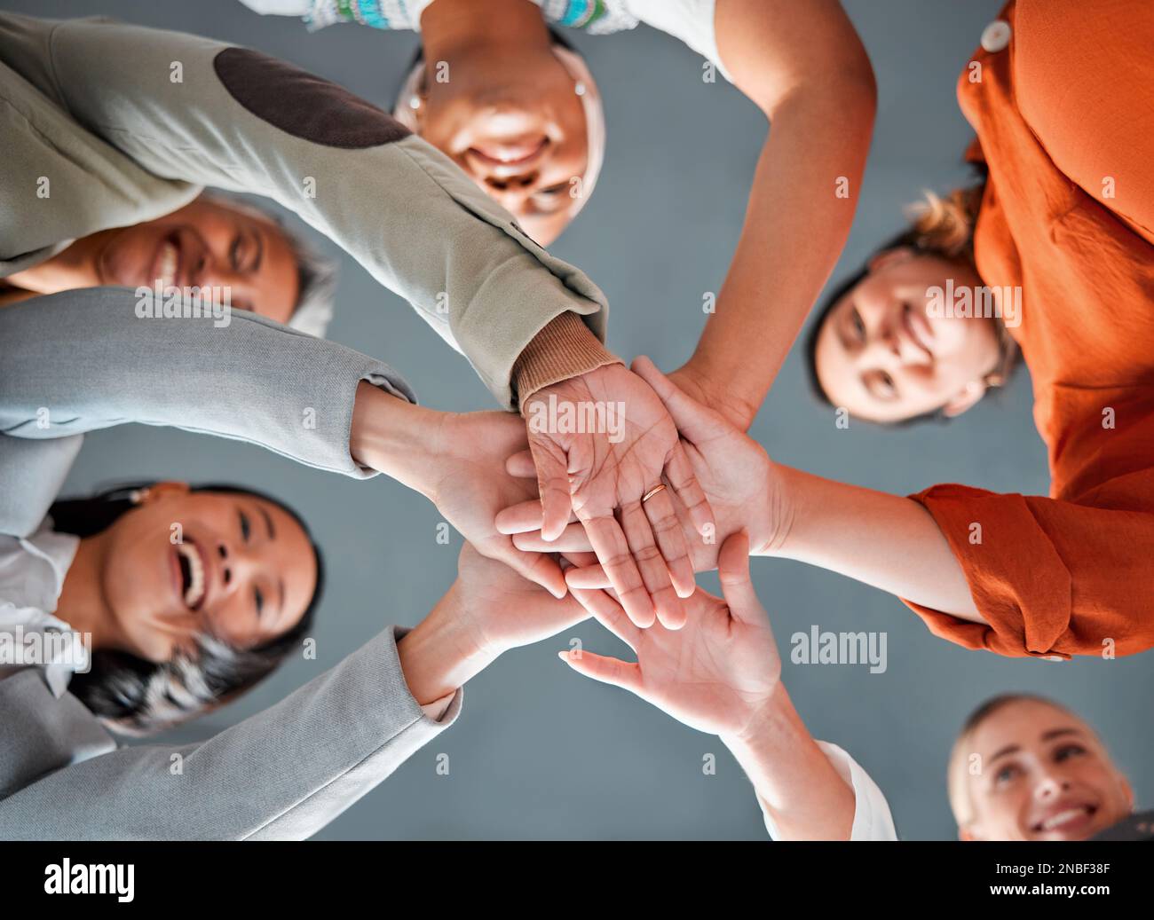 Team building, hands together and diversity of women in office feeling ...