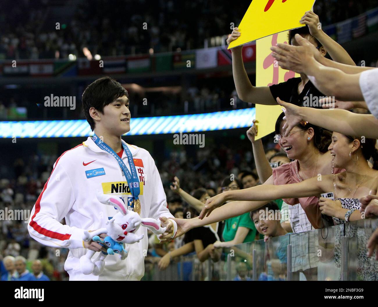 China's Sun Yang is cheered by supporters after winning the men's 800m ...