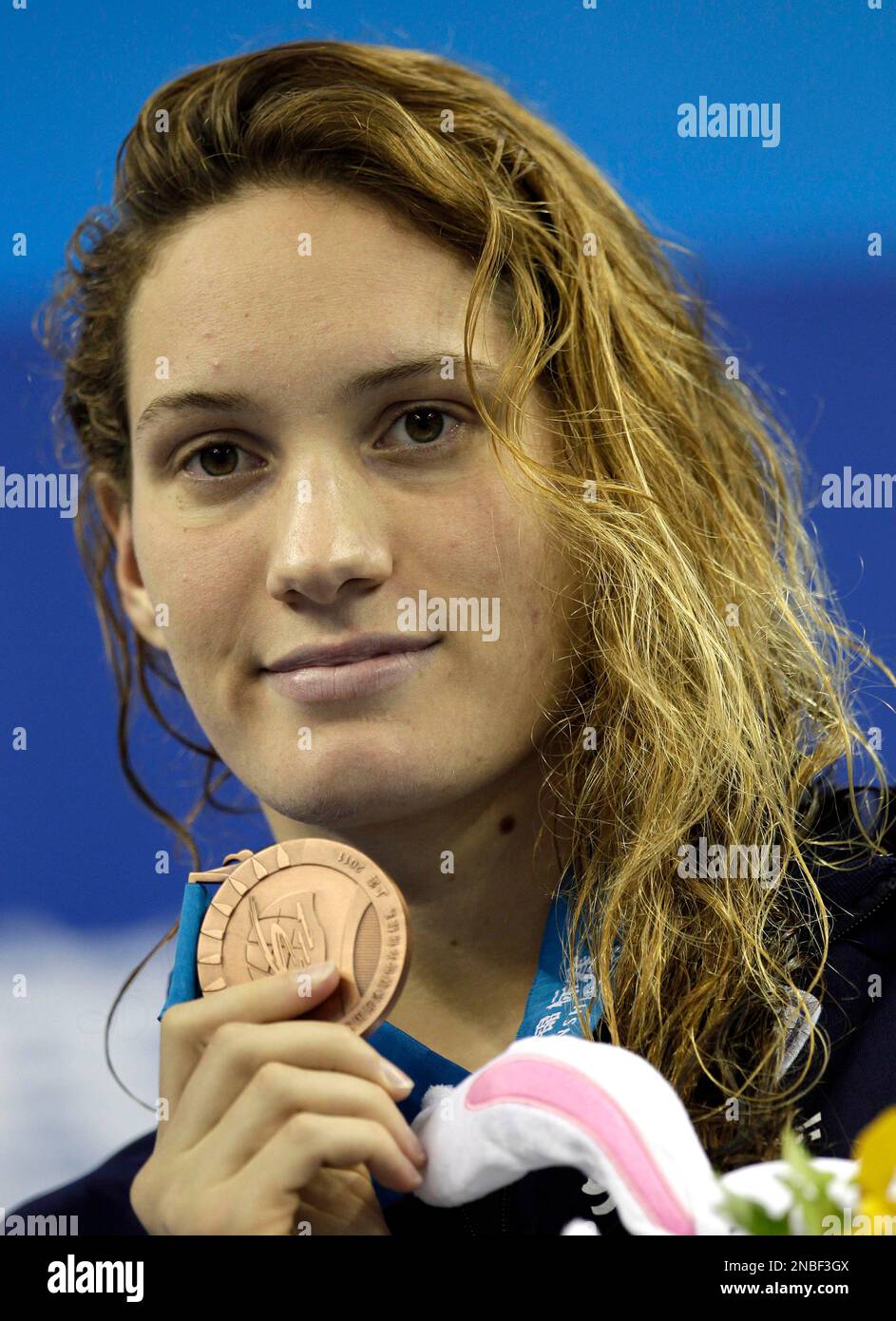 France's Camille Muffat shows the bronze medal she won in the women's ...