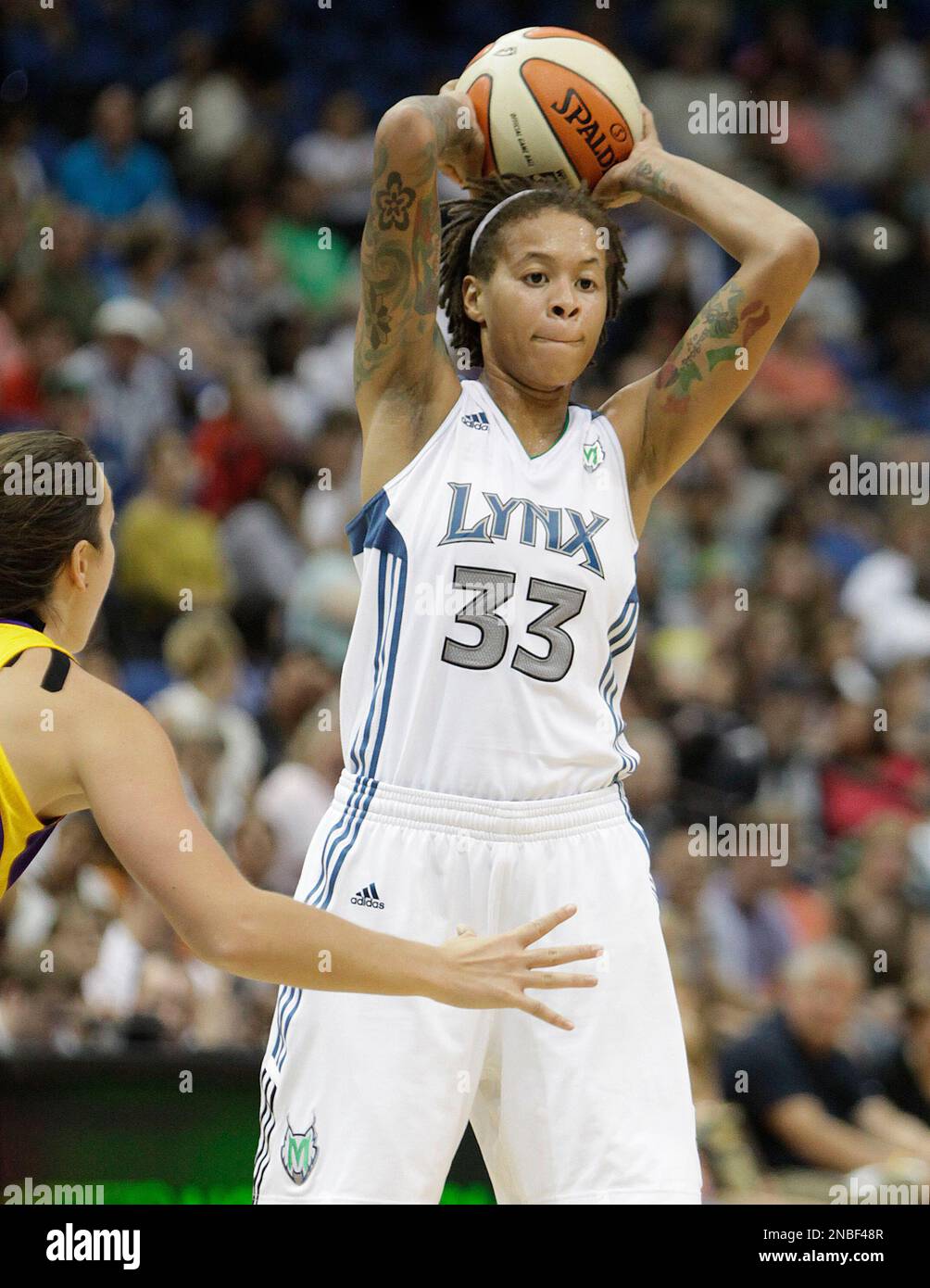 Minnesota Lynx guard Seimone Augustus looks to make a pass against the ...