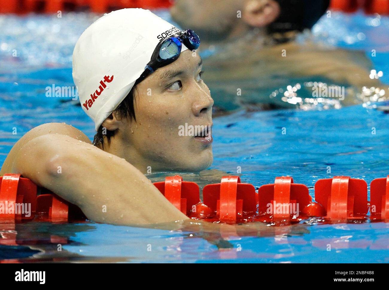 South Korea's Park Tae-hwan looks at the scoreboard after completing ...