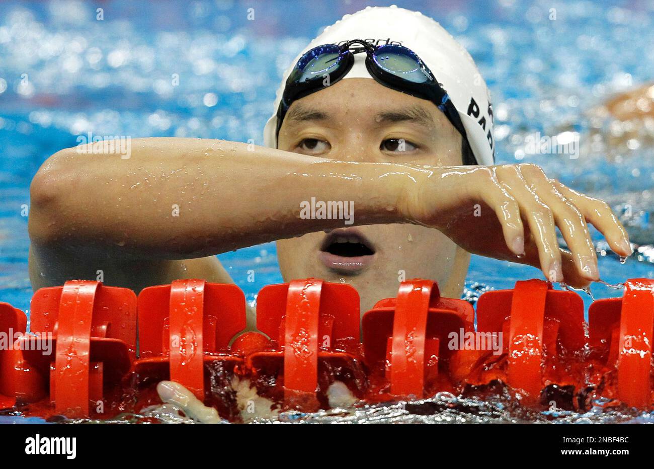 South Korea's Park Tae-hwan looks at the scoreboard after completing a ...
