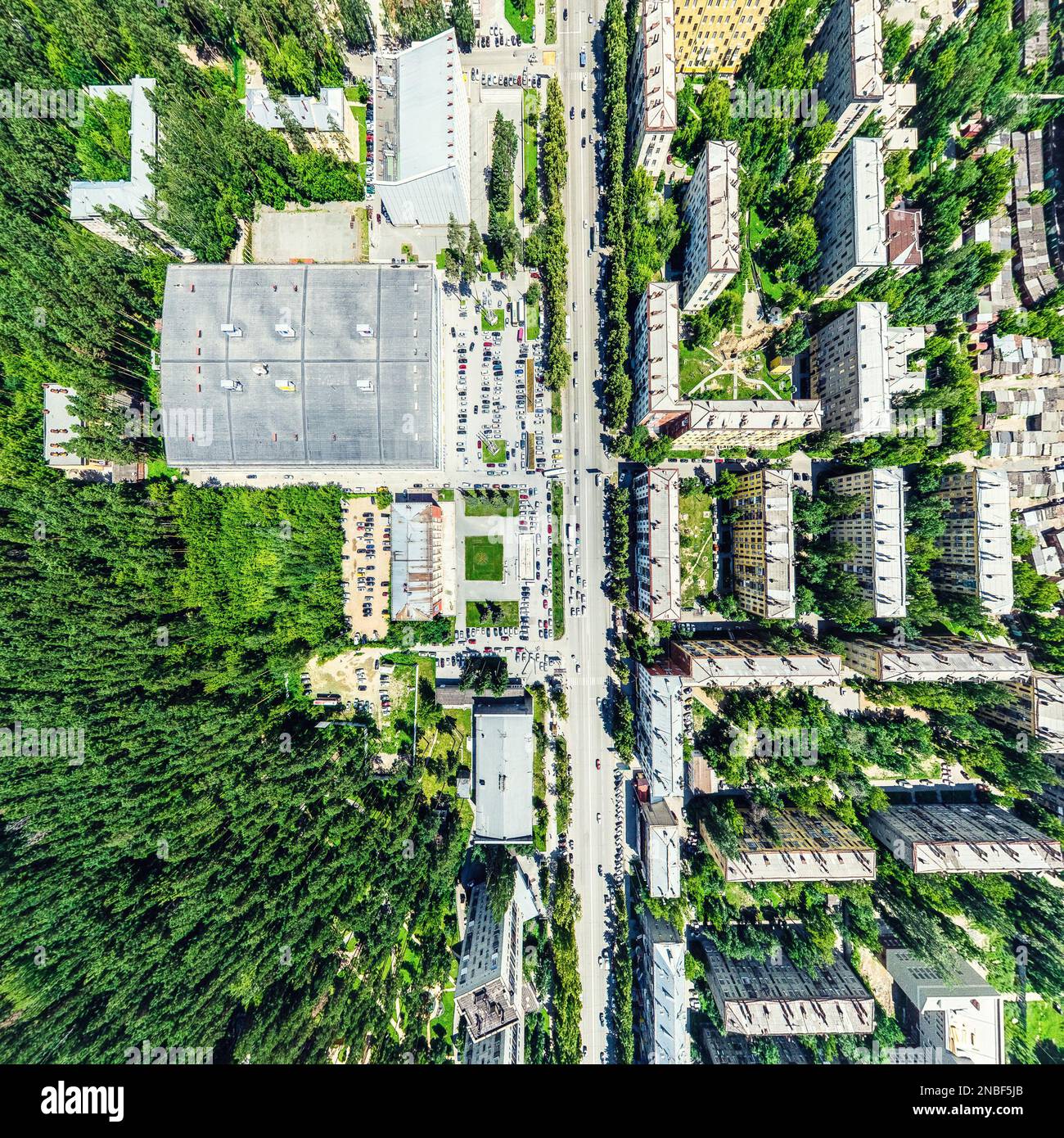 Aerial city view with crossroads and roads, houses, buildings, parks ...