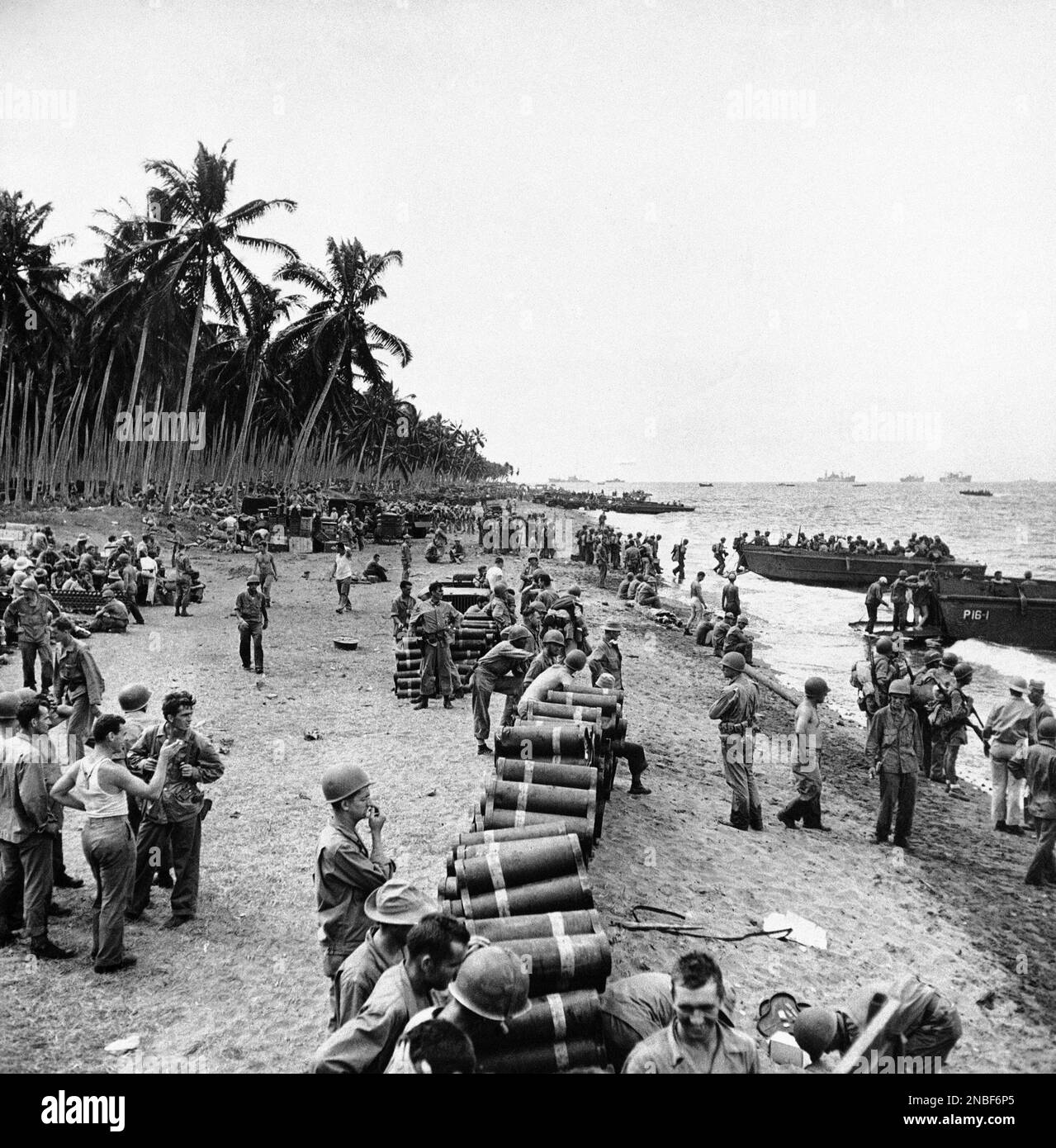 U.S. Marines on the beach near Lunga Point, prepare to leave ...