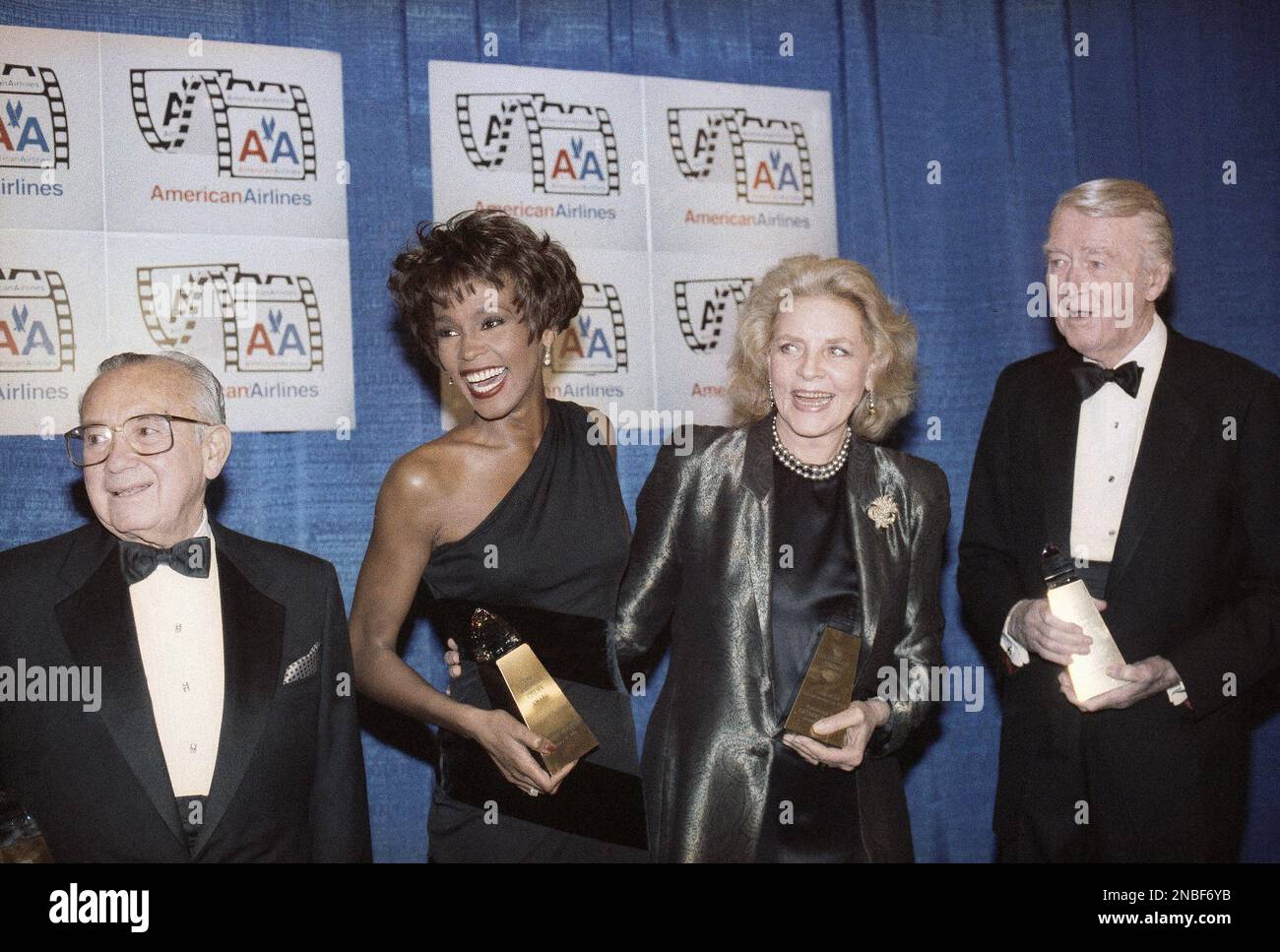 From left, Columbia Pictures chairman Leo Jaffe, Whitney Houston ...
