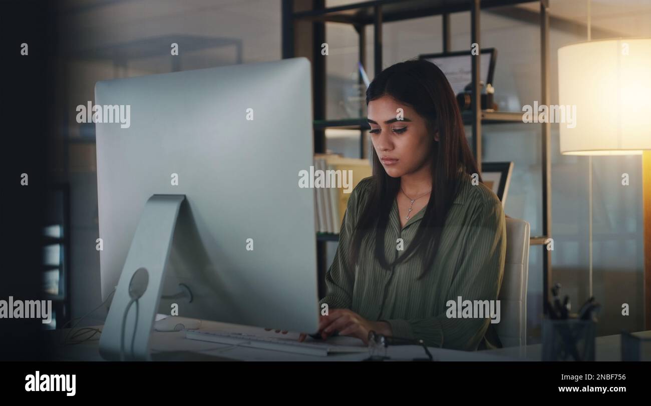 She has some tasks to finish up. a young businesswoman working on a ...
