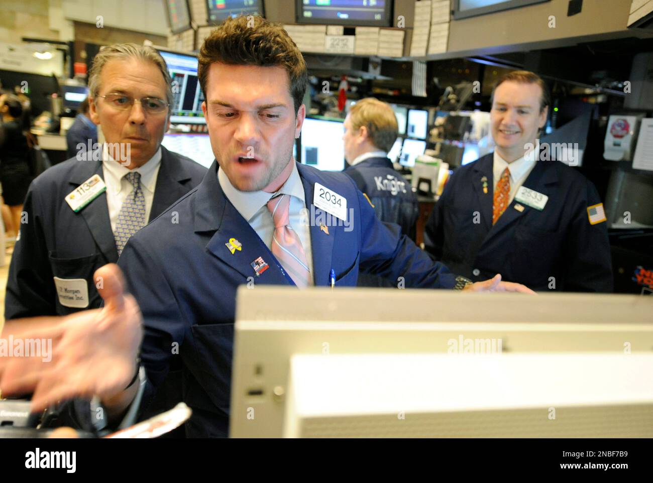 Joseph Dreyer, center, of Knight Capital Americas, works on the floor of the New York Stock ...