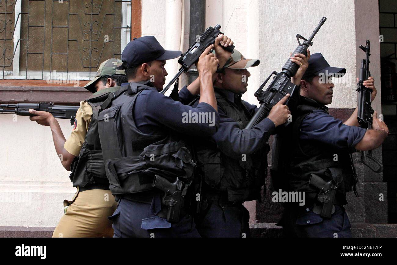 Indian police commandos take position during a drill by security ...