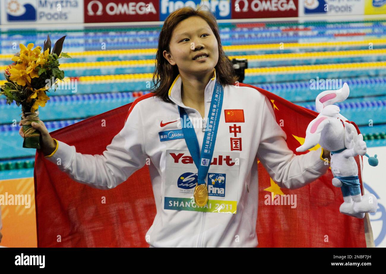 Chinas Zhao Jing Holds Her National Flag After Receiving The Gold Medal In The Womens 100m