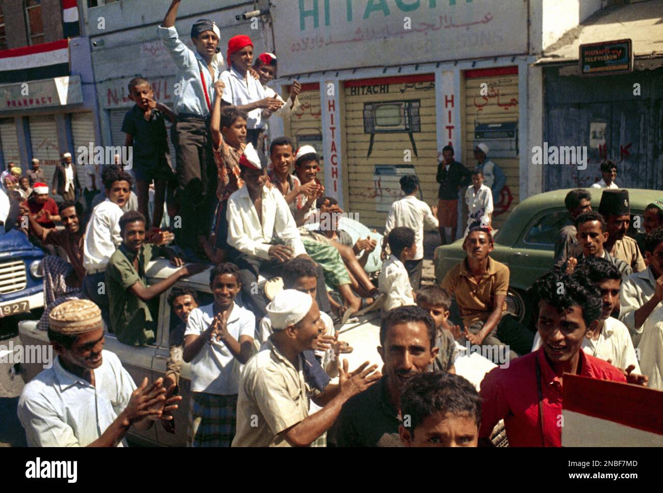 Armed police and Arab nationals celebrate in the Crater District of ...