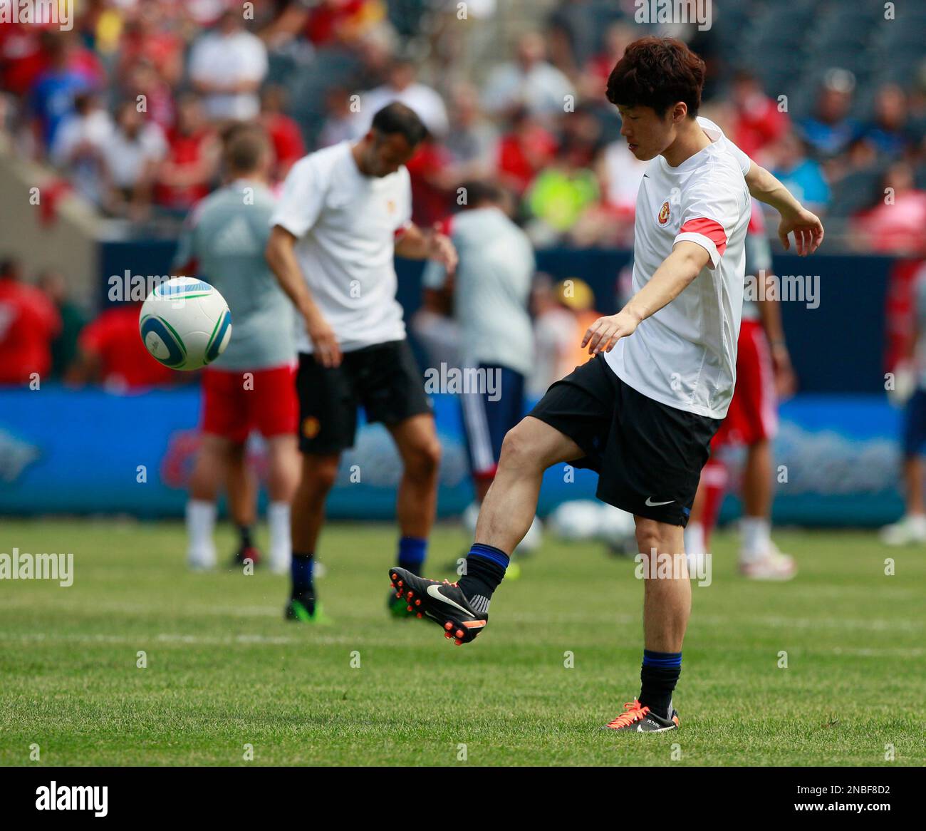Manchester United's Ji-Sung Park, of South Korea, passes the ball ...