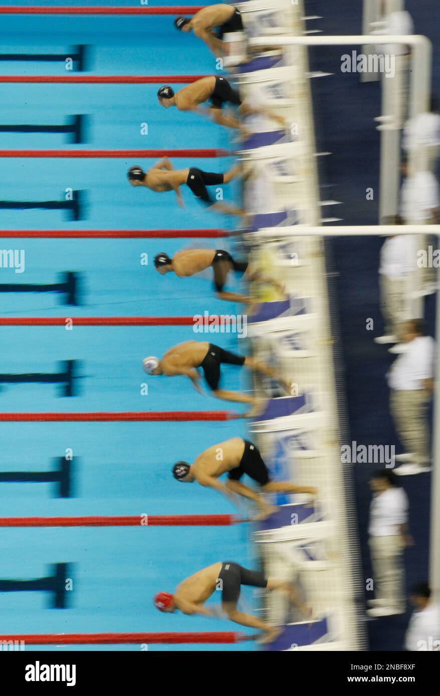 Swimmers dive in for the start of a men's 800m Freestyle heat at the ...