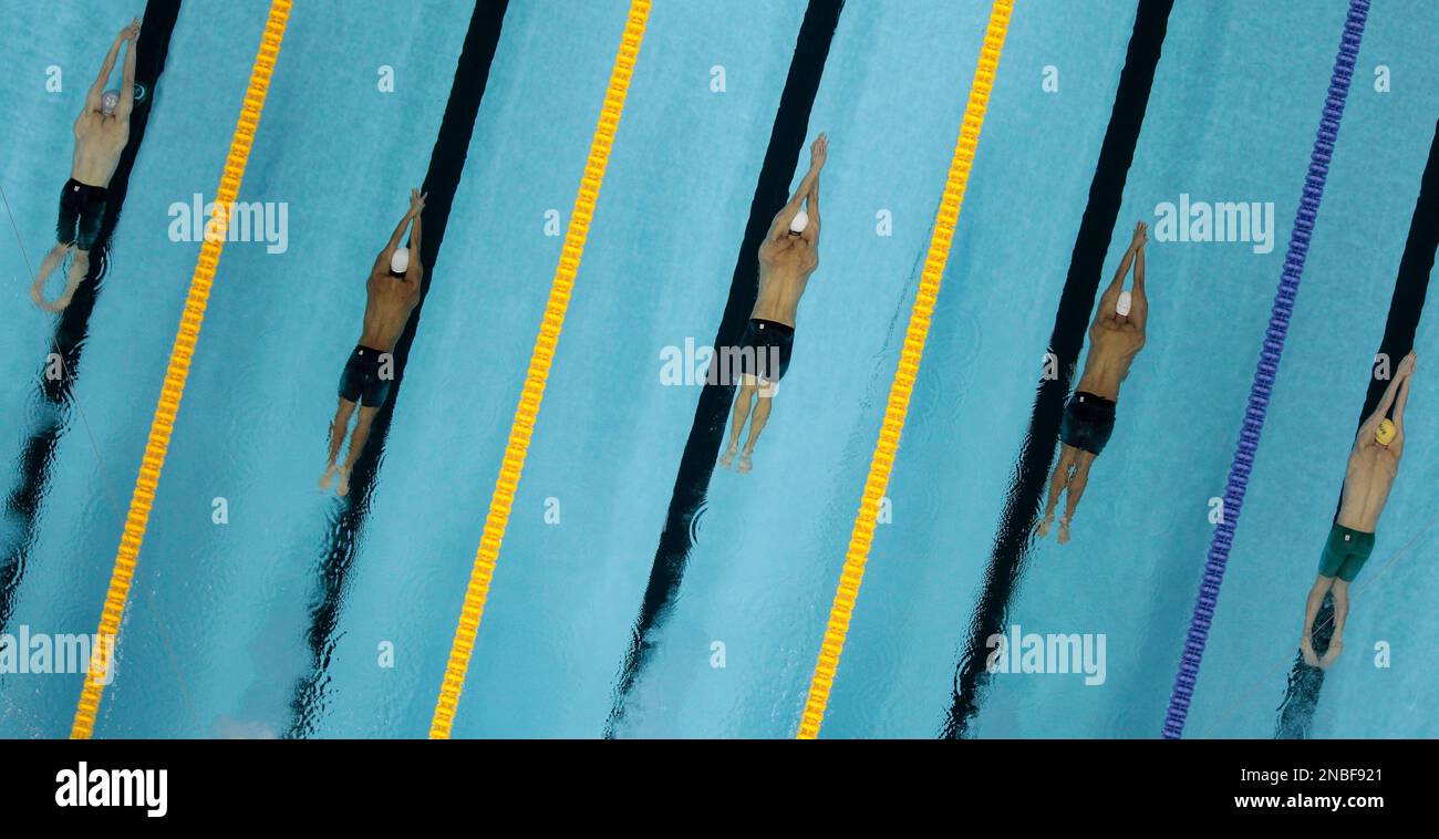 U.S. Michael Phelps, center, competes in a men's 200m Butterfly heat at ...