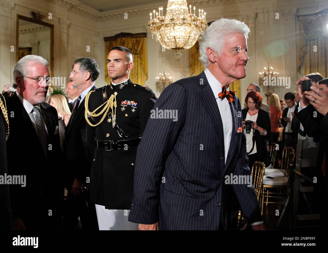 San Francisco Giants owner Bill Neukom, right, is followed by General ...