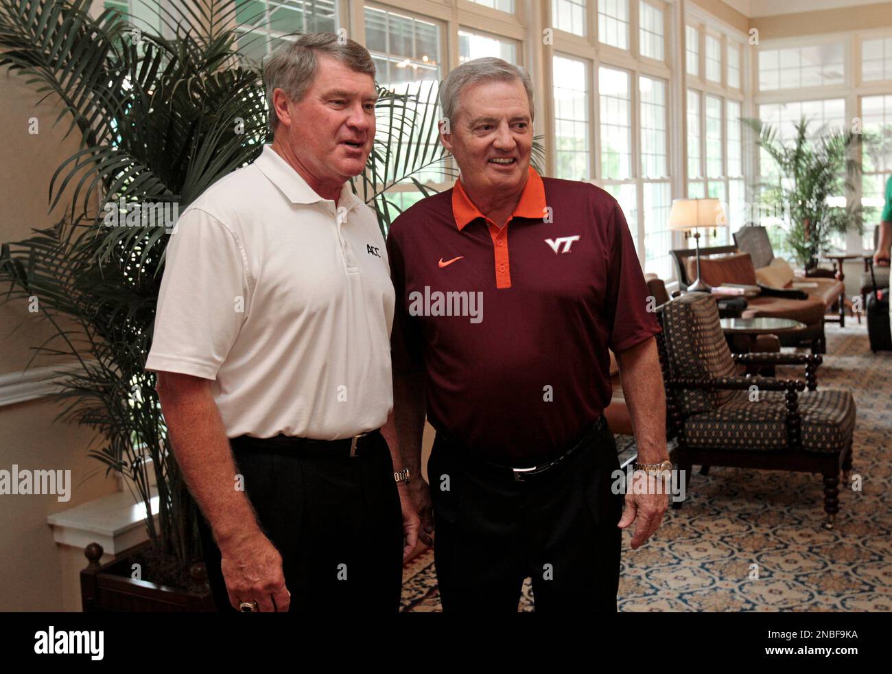 ACC Commissioner John Swofford, left greets Virginia Tech coach Frank ...