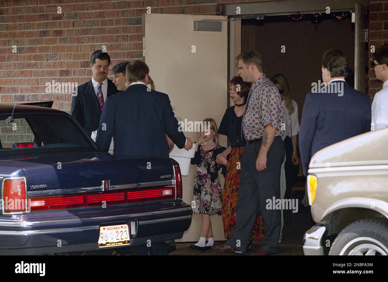 Kenneth Lakeberg, right, and his wife, Reitha, follow the casket with ...
