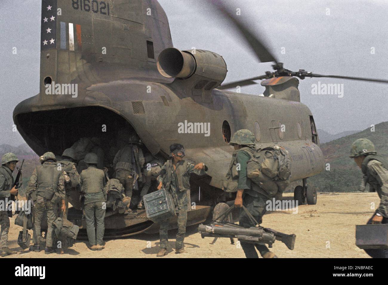 ARVN troops board U.S. Chinook helicopters near the DMZ in an undated ...