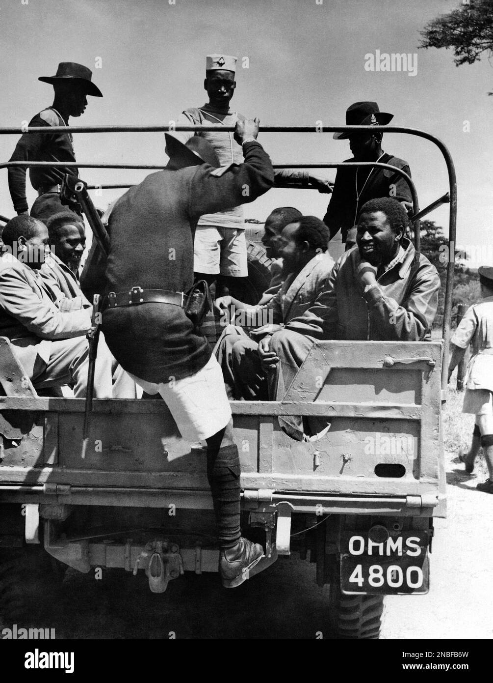 Jomo Kenyatta, second from left, and other accused arrive at the court ...