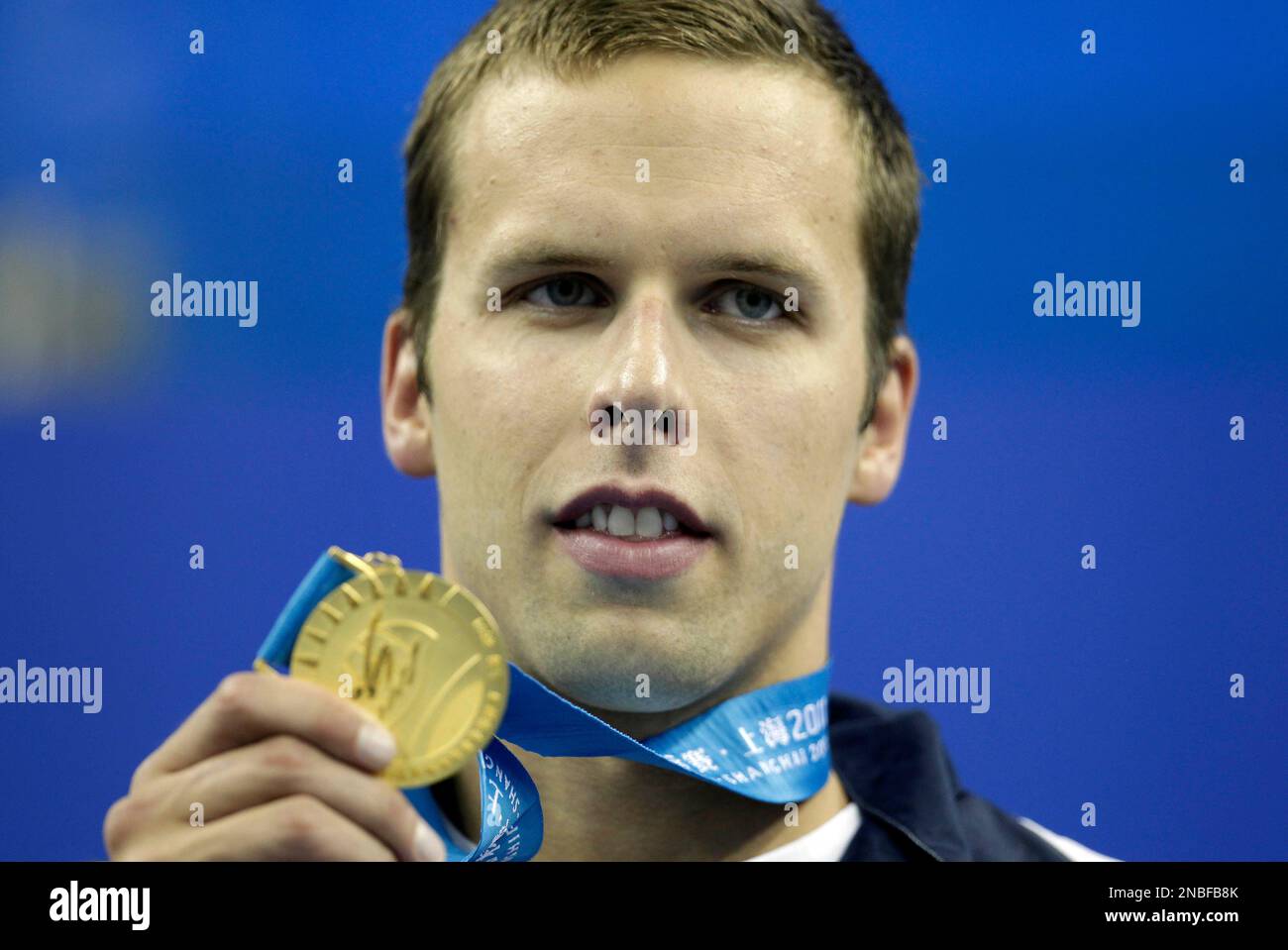 Norway's Alexander Dale Oen shows the gold medal he won in the men's ...