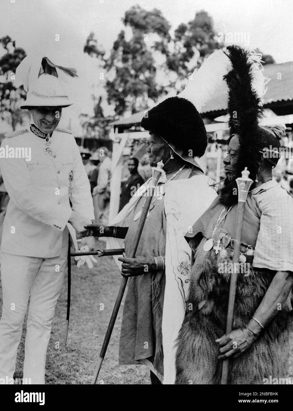 Sir Evelyn Baring, Governor of Kenya, shakes hands with Senior Chief ...