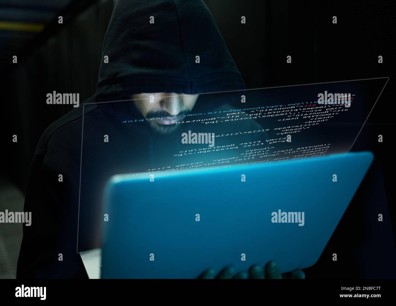 Cyber security, crime and hacker with laptop typing in data center, stealing sensitive digital ...