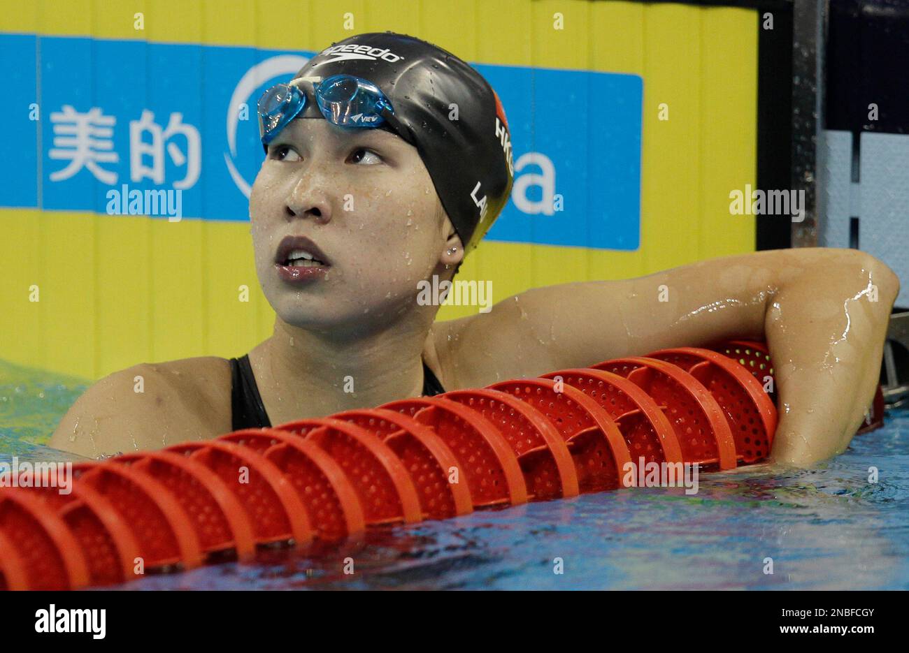 Hong Kong's Lau Yin Yan looks at the scoreboard after completing her ...