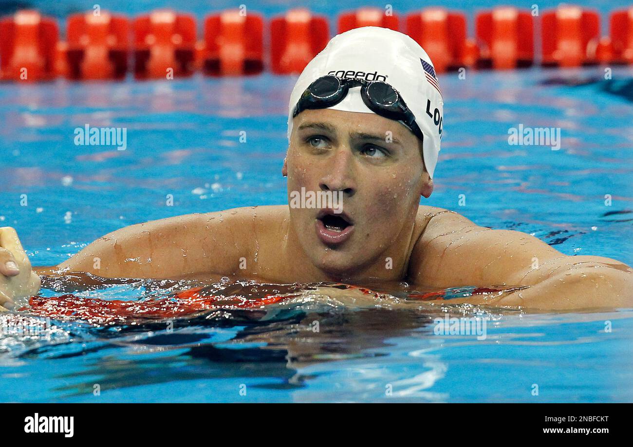 Ryan Lochte of the U.S. reacts after completing his heat of the men's ...