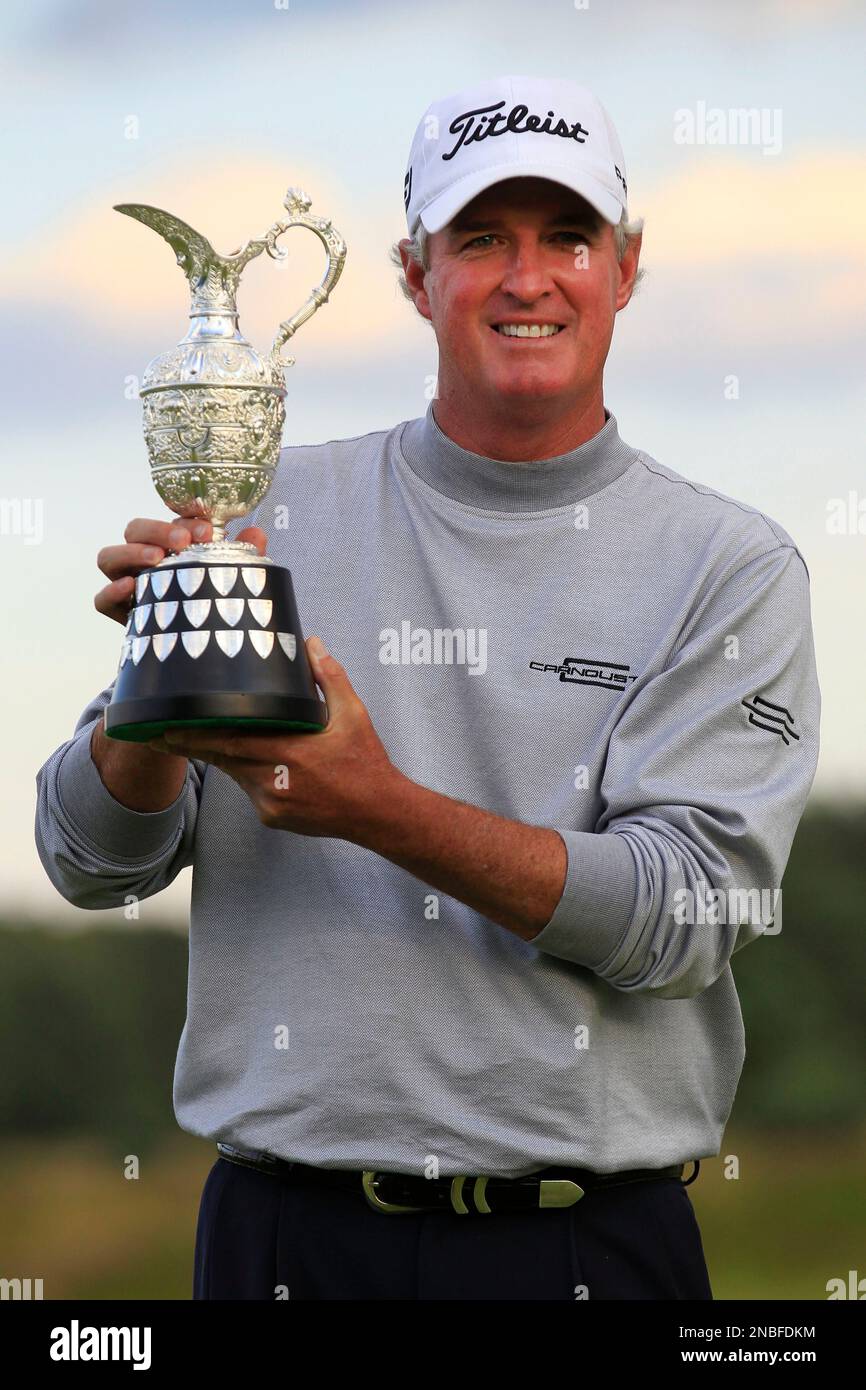 Russ Cochran of the U.S. poses with his trophy for the media after ...